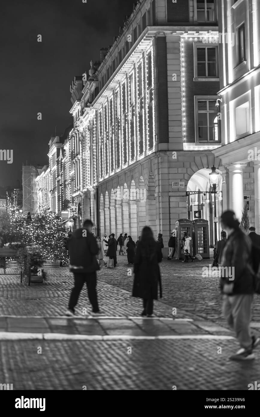 Shoppers walking past Black and White Stock Photos & Images - Alamy