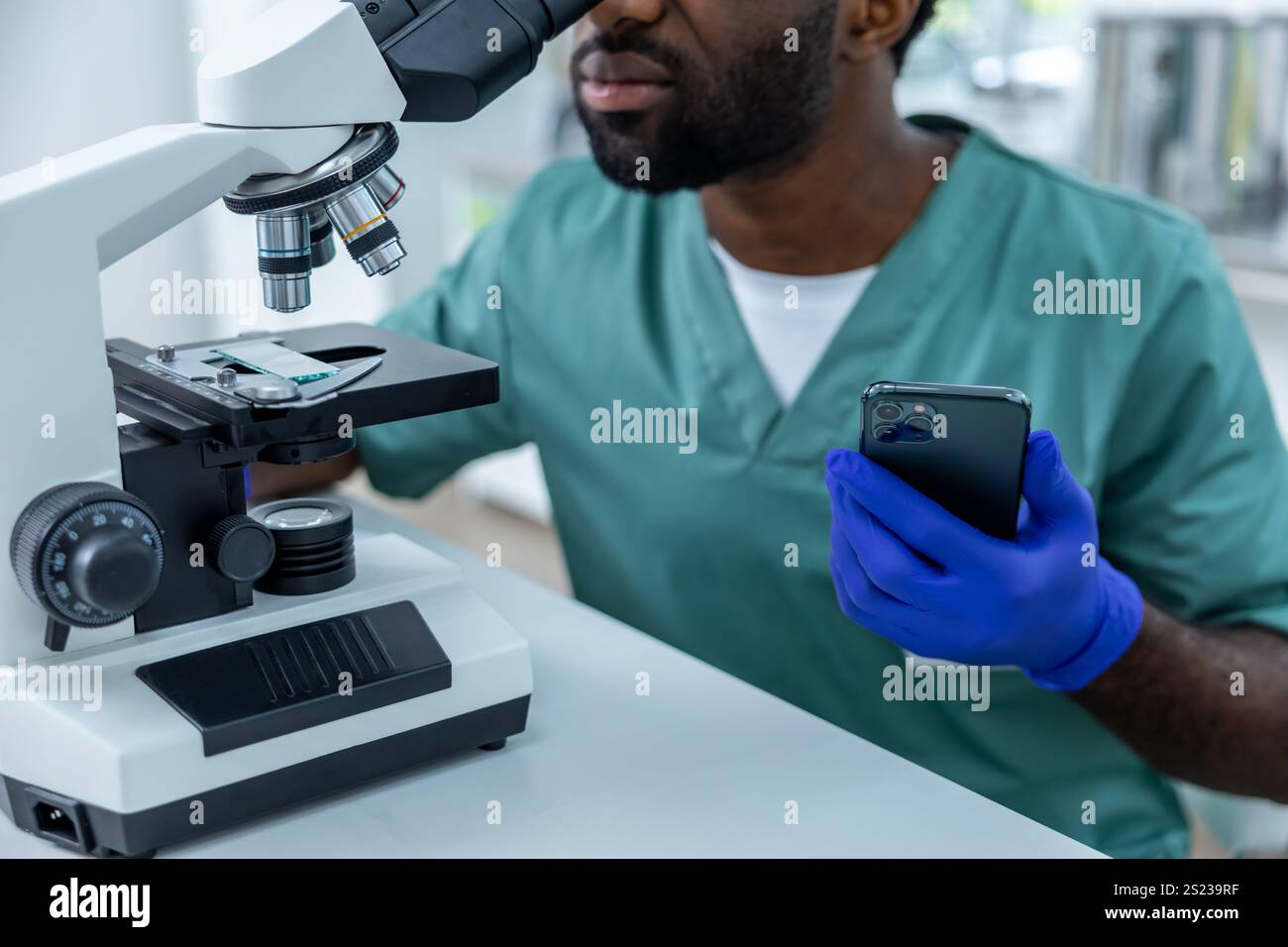 Scientist in laboratory conducting experiment and tests on samples ...