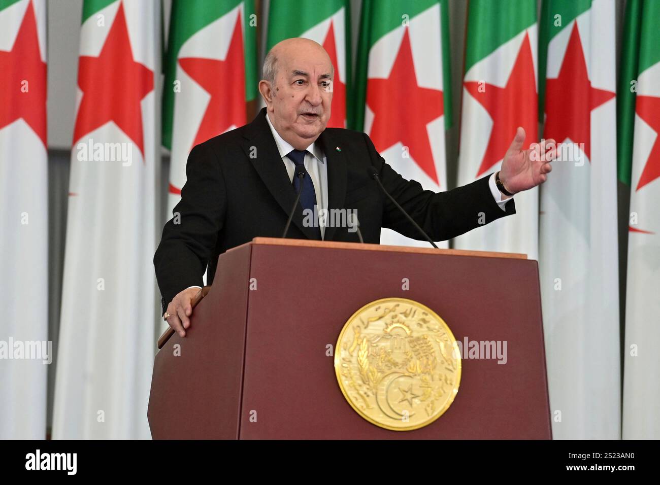Algerian President Abdelmajid Tebboune delivers his speech to the two ...