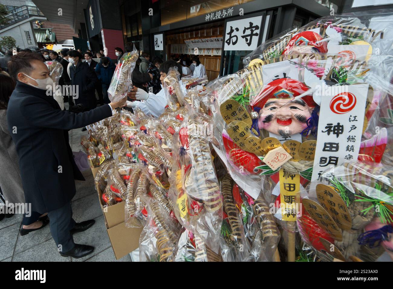 Tokyo, Japan. 06th Jan, 2025. Worshipper buy Bamboo Rake "Engi Kumade ...