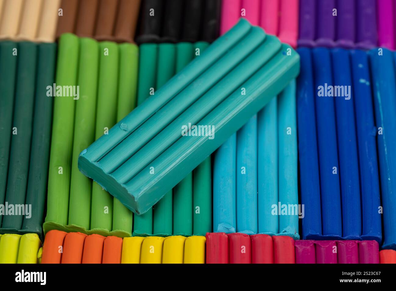 plasticine of different colors for modeling closeup, a simple colored ...