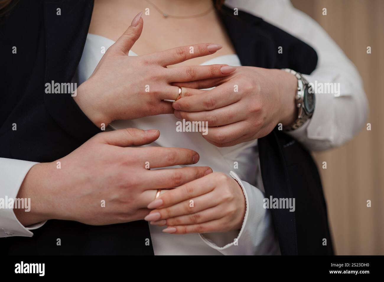Intimate Moment of Engagement: Hands Embracing with Wedding Rings Stock ...