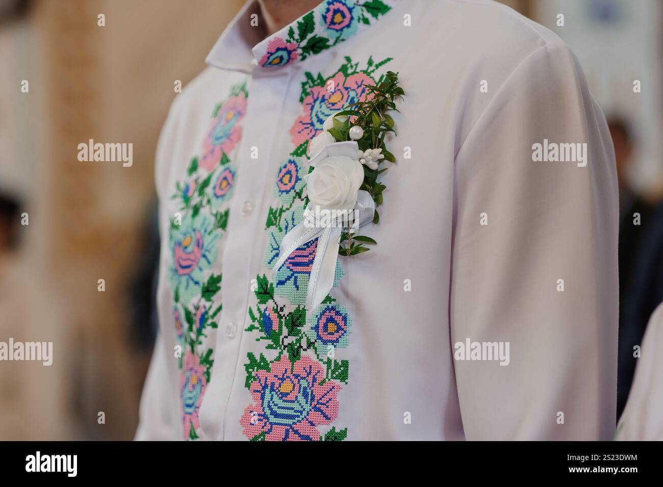 Elegant Traditional Garment Adorned with Floral Embroidery and Corsage ...