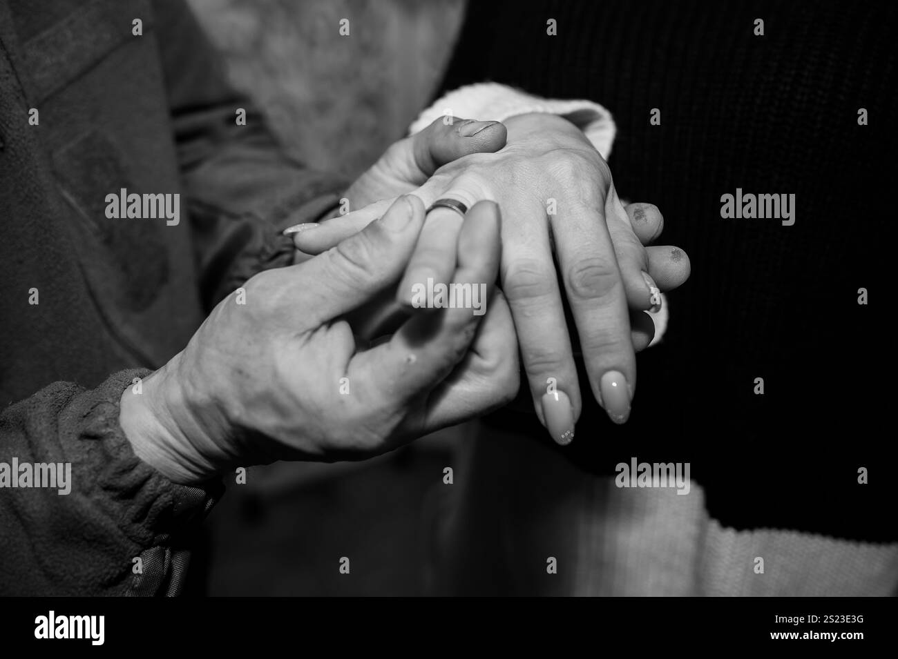 Intimate Moment of Ring Exchange Between Hands Stock Photo - Alamy