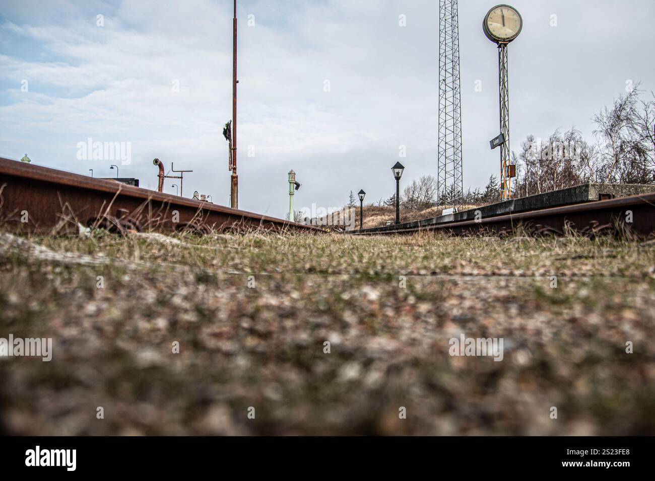Railway tracks at a closed station with a watch Stock Photo - Alamy