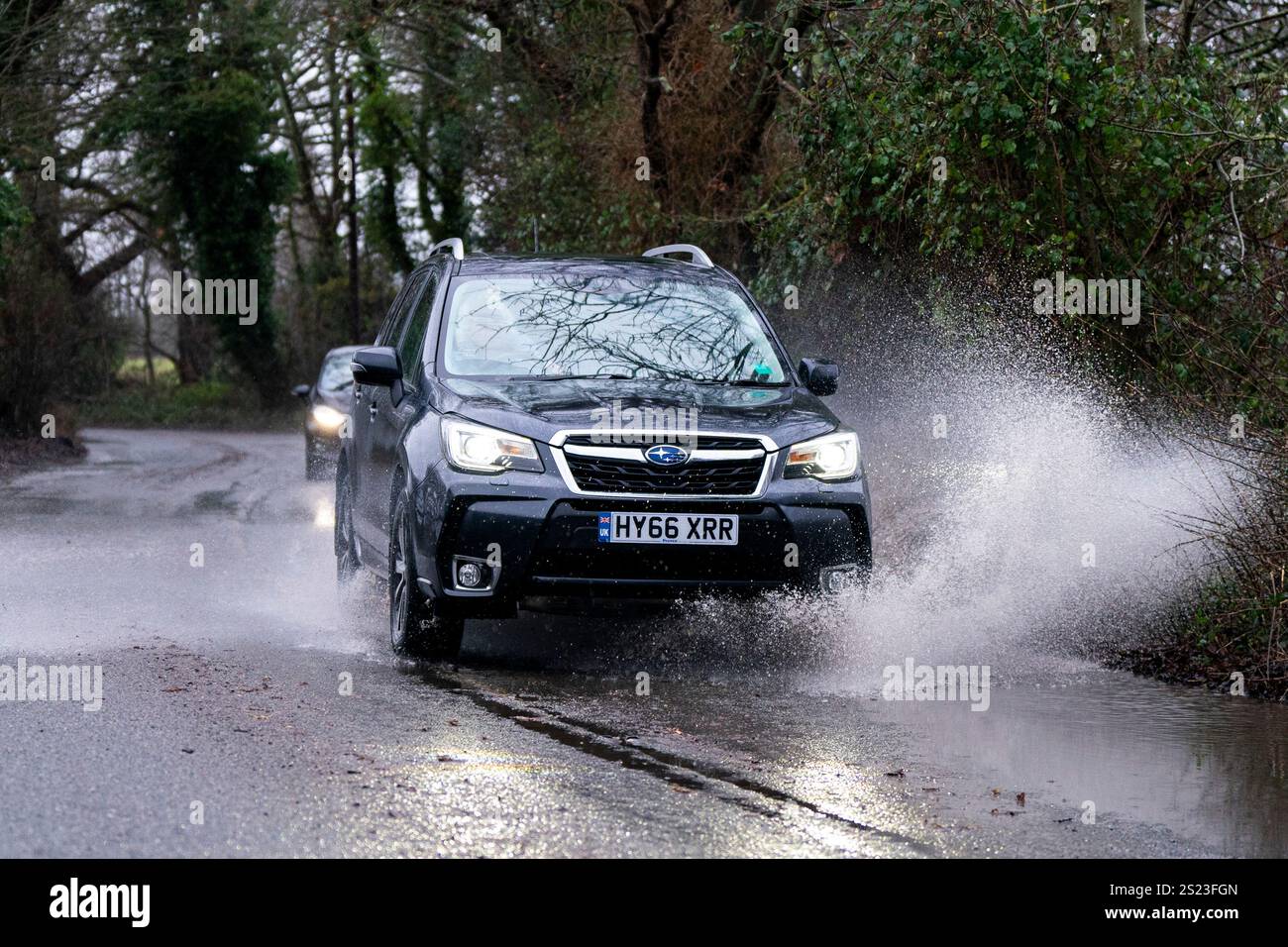 Traffic in wet conditions near Cobham in Surrey. Weather warnings ...