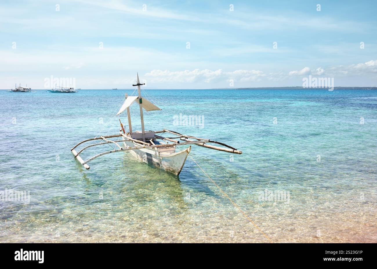 Bangka boat on the shore of Malapascua Island, Philippines Stock Photo ...