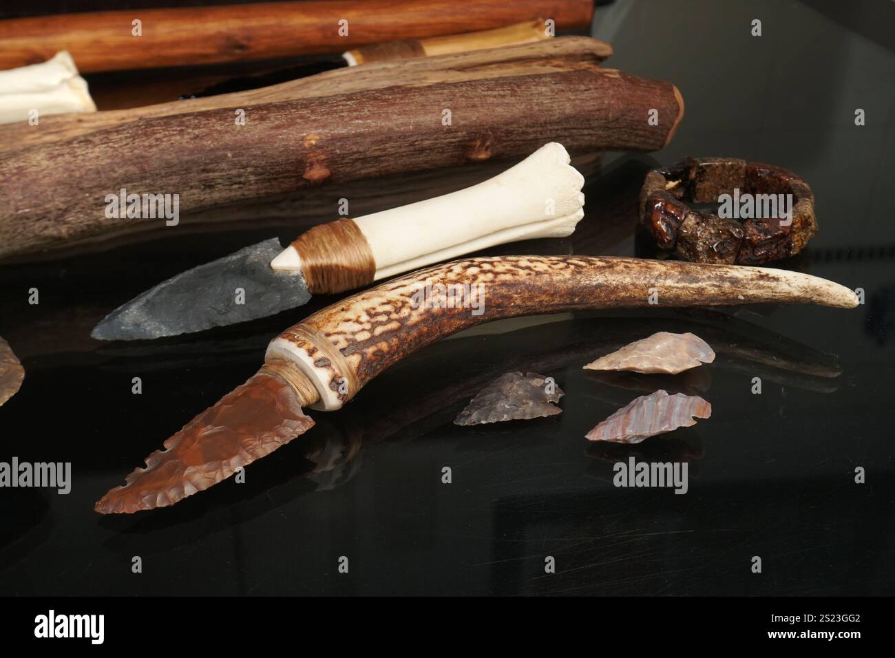 Stone Age Tools with Knives black Background Stock Photo - Alamy