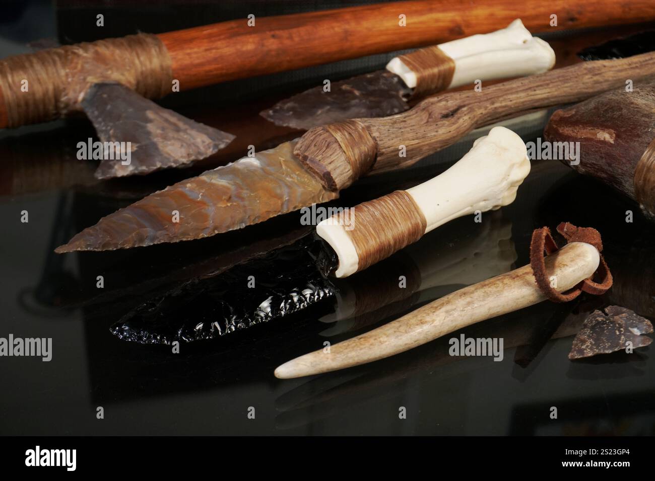 Stone Age Tools with Knives black Background Stock Photo - Alamy