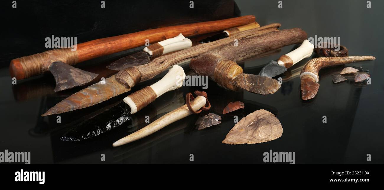Stone Age Tools with Knives black Background Stock Photo - Alamy