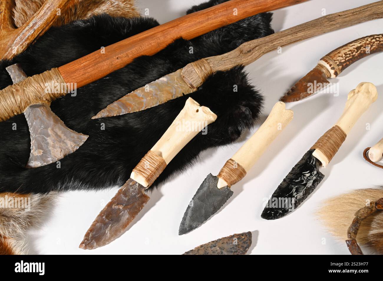 Stone Age Tools with Knives and Animal Fur Stock Photo - Alamy
