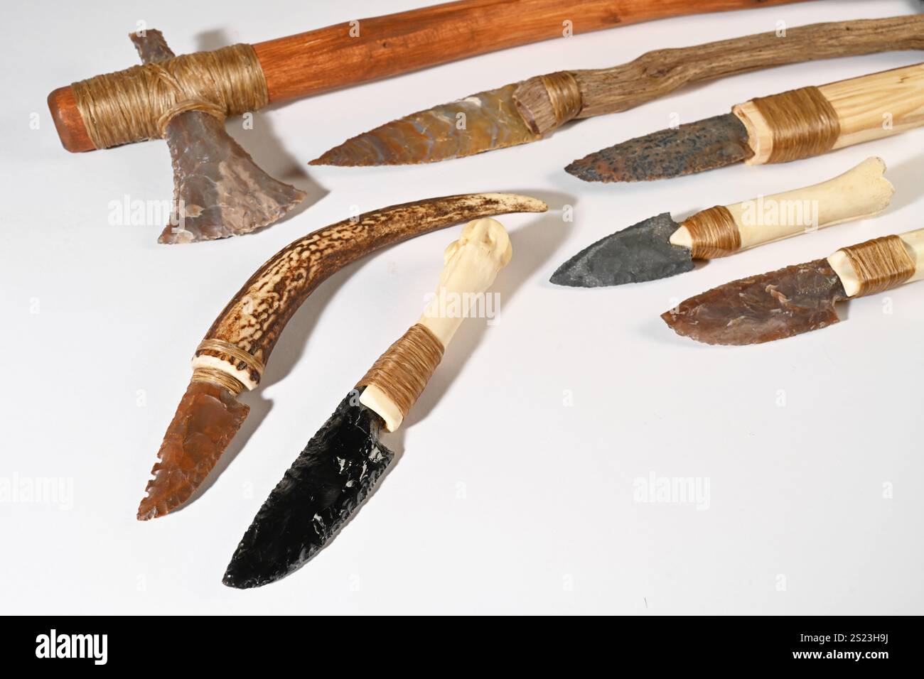 Stone Age Tools isolated on white Background Stock Photo - Alamy