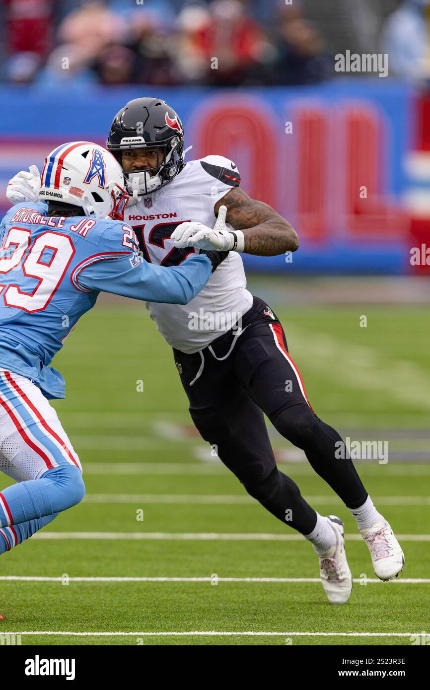 Houston Texans wide receiver Nico Collins (12) is blocked by Tennessee ...