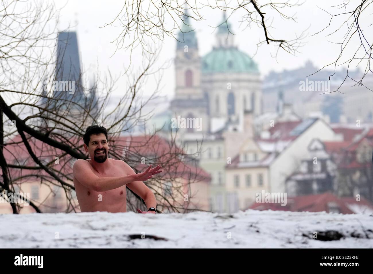 A polar swimmer warms up after the traditional Three Kings swim in the ...