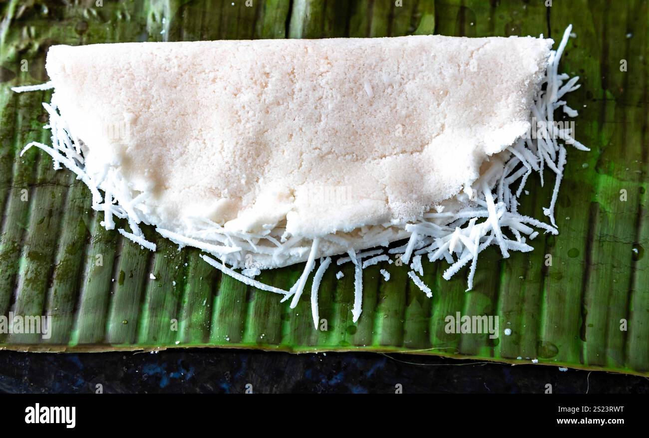 Traditional Brazilian tapioca with coconut served on a banana leaf ...