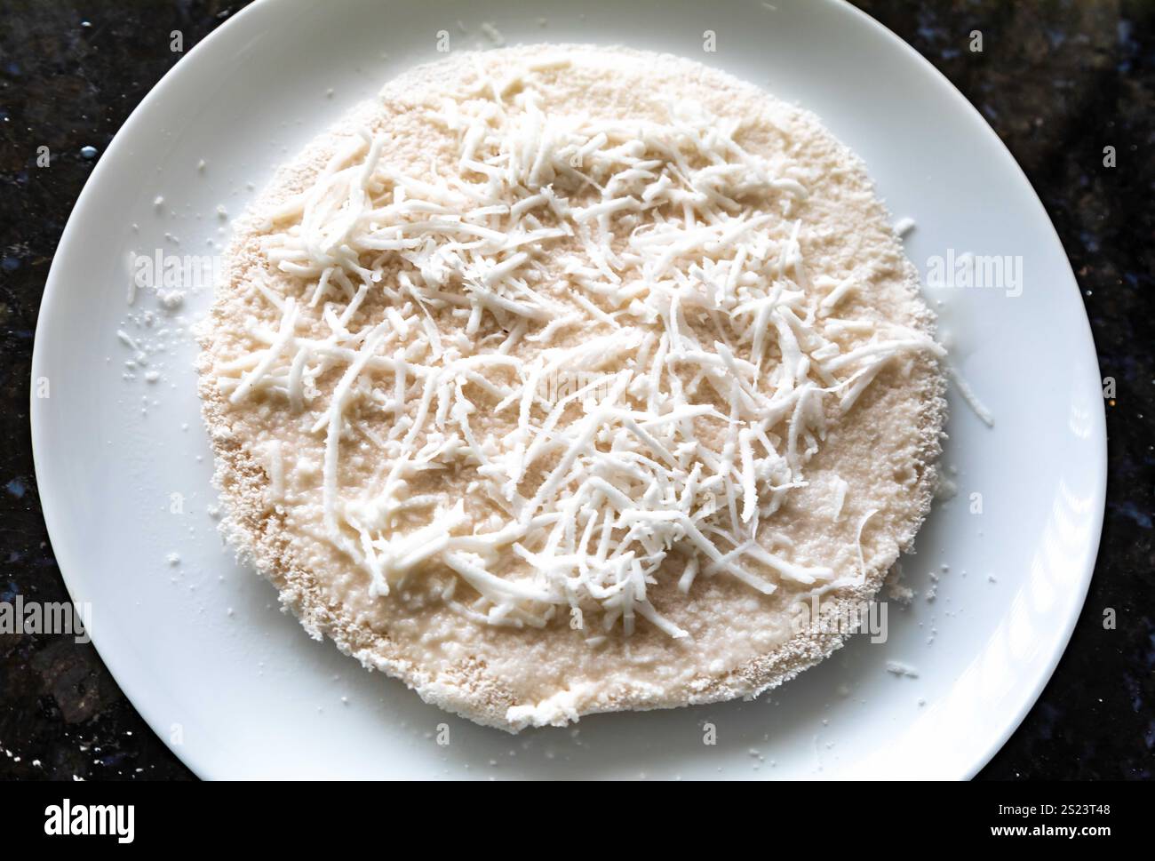 Traditional Brazilian tapioca with coconut served on a banana leaf ...