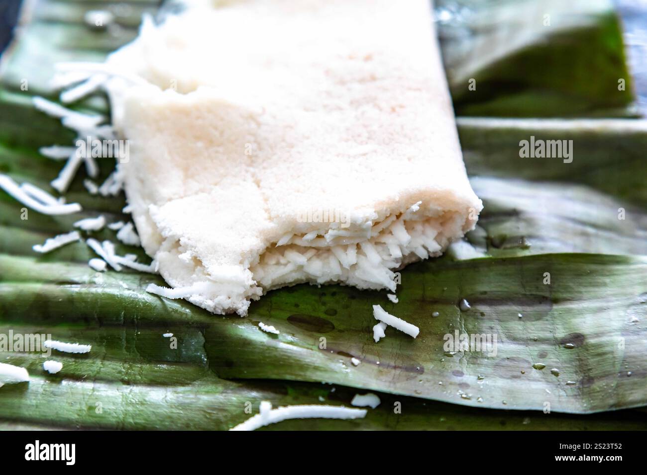 Traditional Brazilian tapioca with coconut served on a banana leaf ...