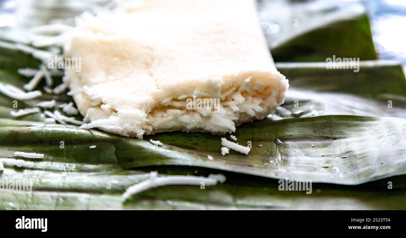 Traditional Brazilian tapioca with coconut served on a banana leaf ...