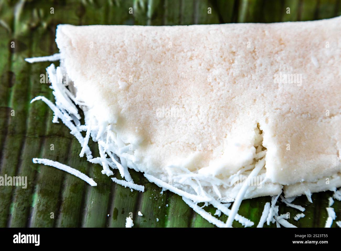 Traditional Brazilian tapioca with coconut served on a banana leaf ...