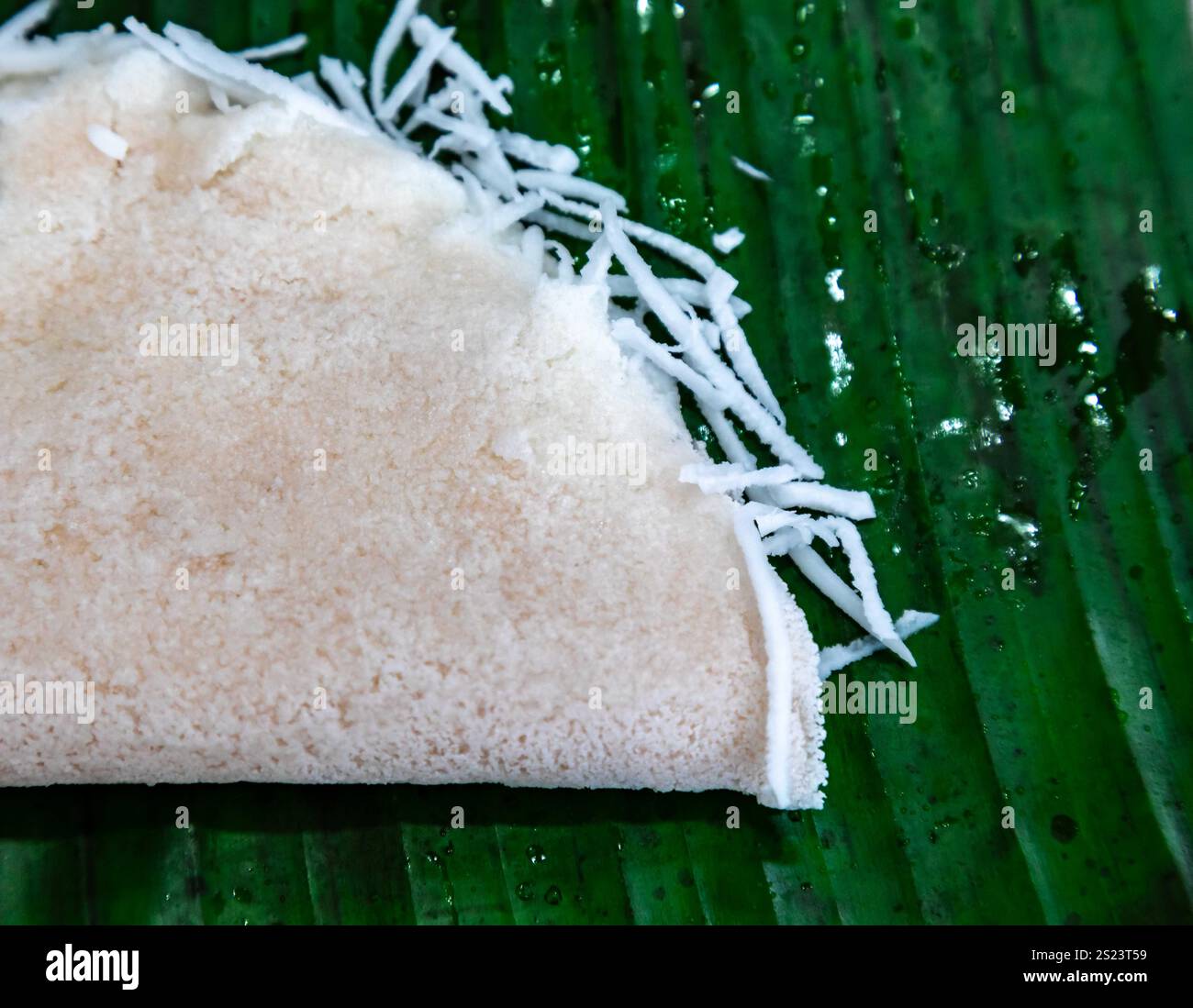 Traditional Brazilian tapioca with coconut served on a banana leaf ...