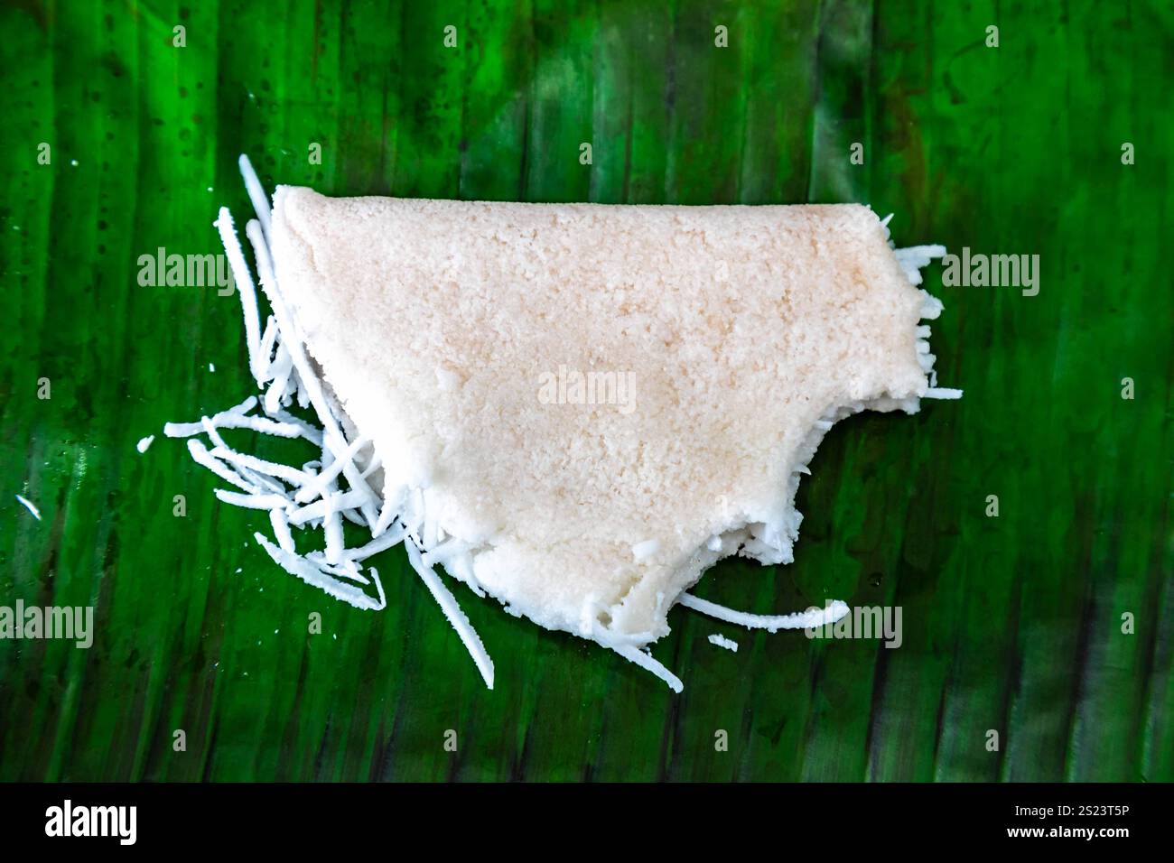 Traditional Brazilian tapioca with coconut served on a banana leaf ...