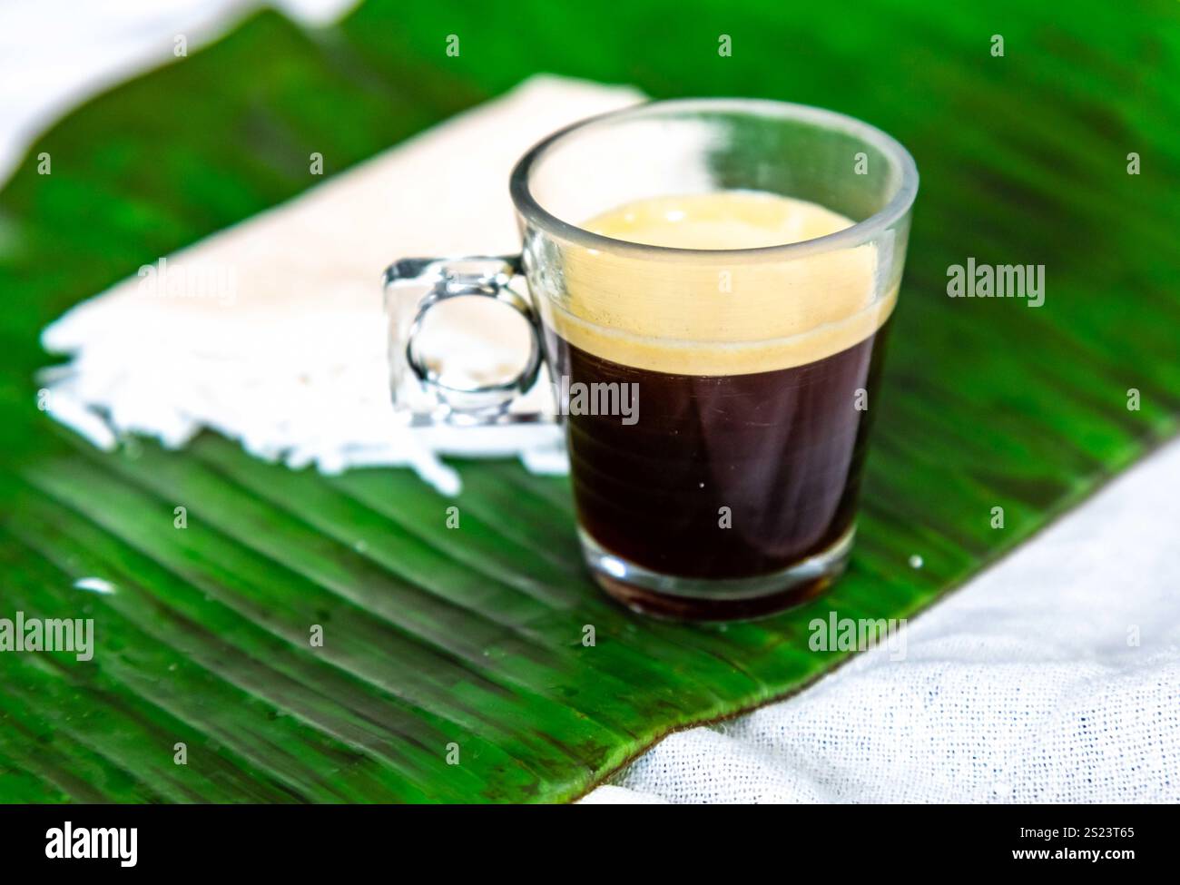 Traditional Brazilian tapioca with coconut served on a banana leaf ...