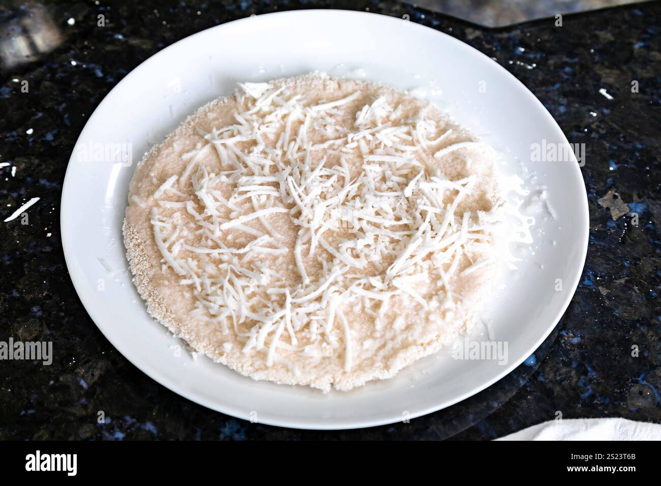 Traditional Brazilian tapioca with coconut served on a banana leaf ...