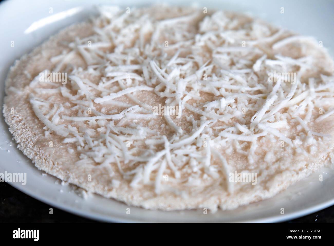 Traditional Brazilian tapioca with coconut served on a banana leaf ...