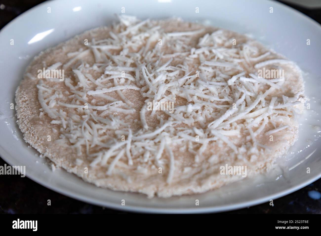 Traditional Brazilian tapioca with coconut served on a banana leaf ...