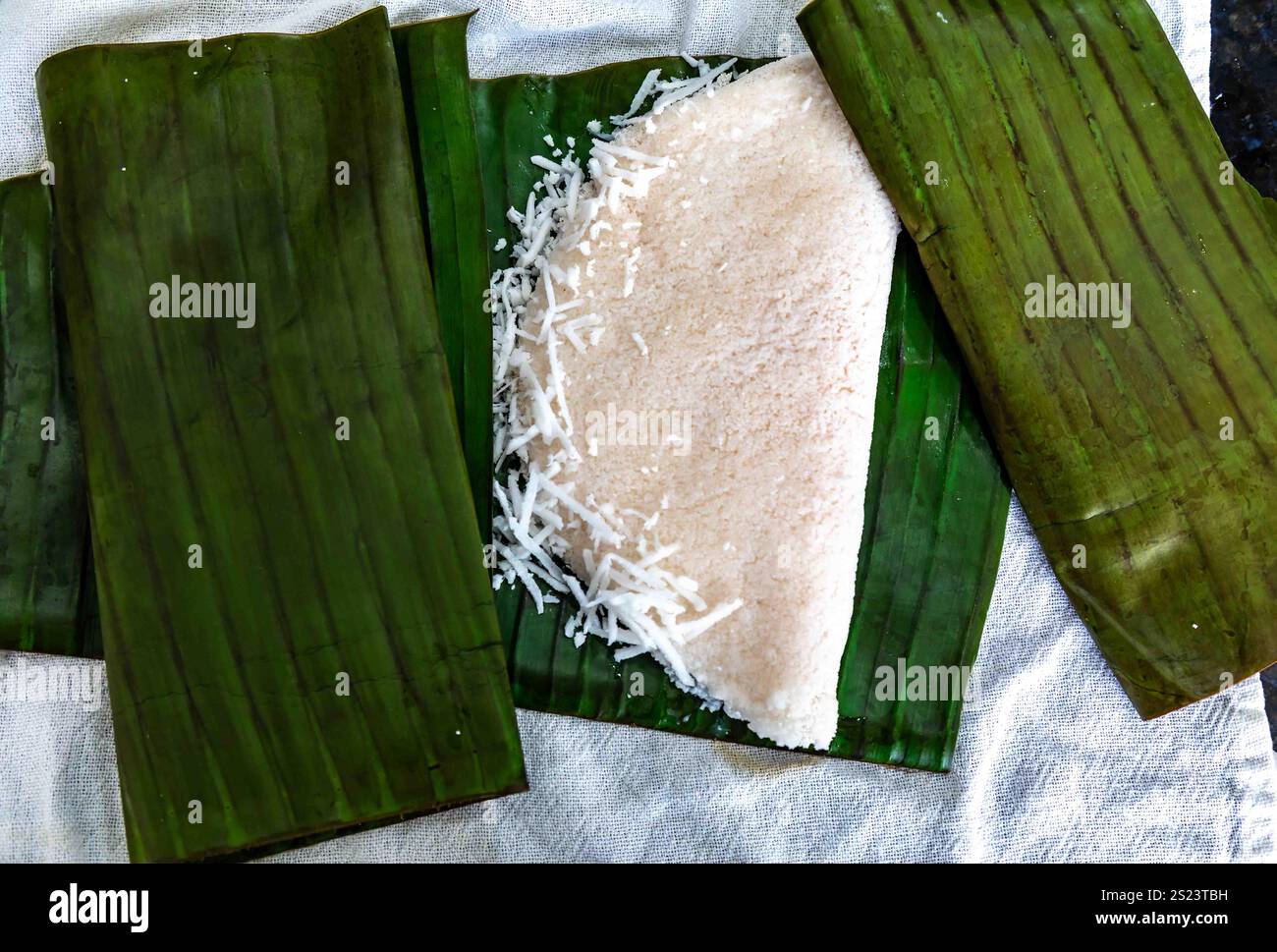 Traditional Brazilian tapioca with coconut served on a banana leaf ...