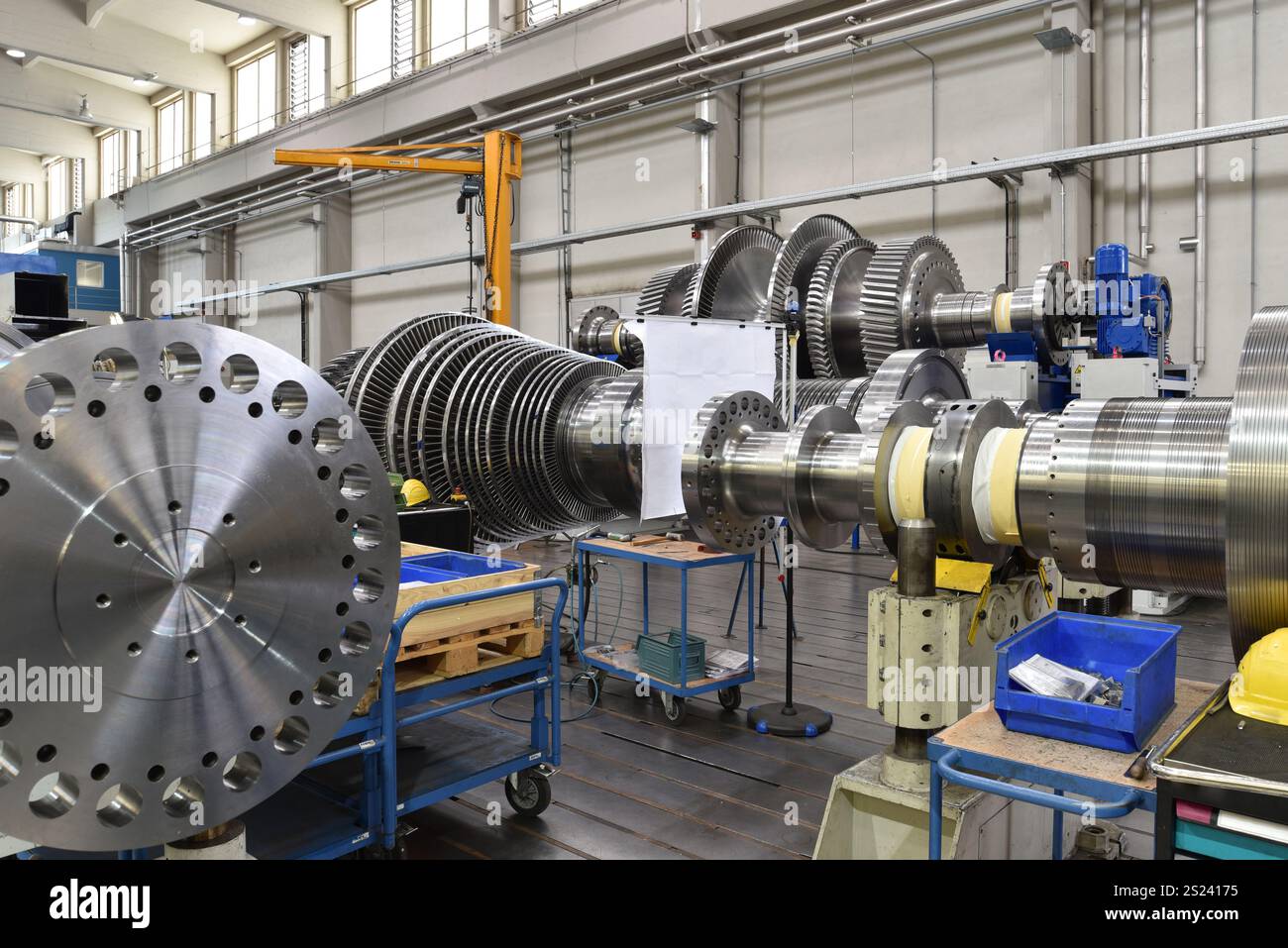 assembling and constructing gas turbines in a modern industrial factory ...