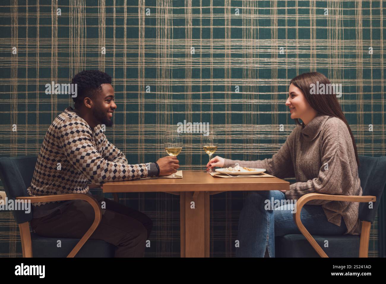Young couple having romantic dinner on their first date Stock Photo - Alamy