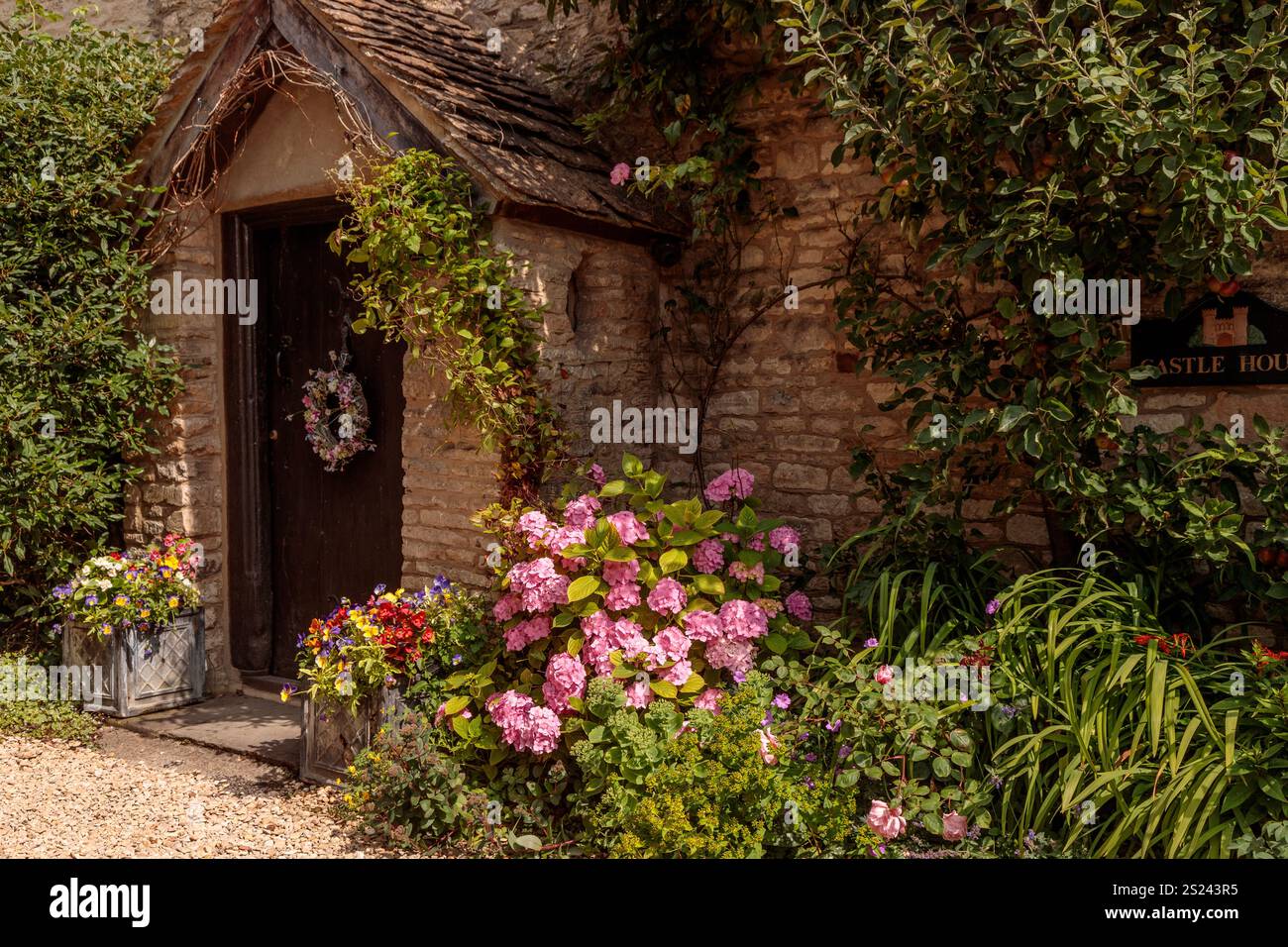 Old fashioned cottage at Castle Coombe, Wiltshire, England Stock Photo ...