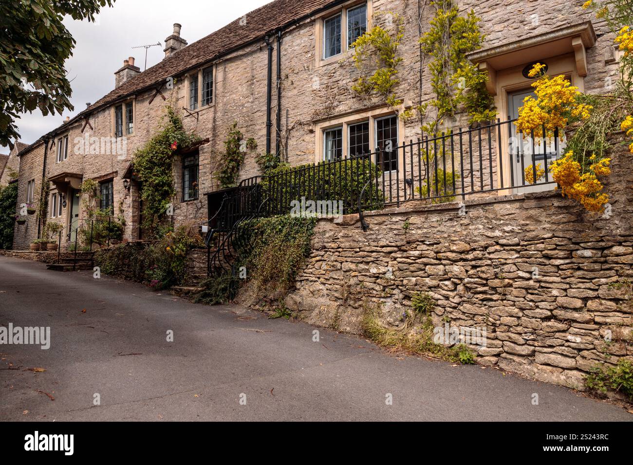 Old fashioned row of cottages at Castle Coombe, Wiltshire, England ...
