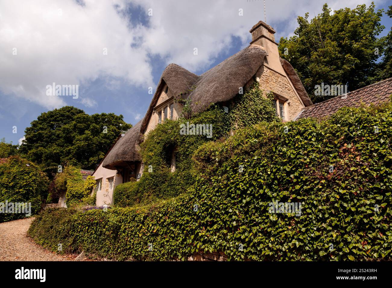 Old fashioned cottage at Castle Coombe, Wiltshire, England Stock Photo ...