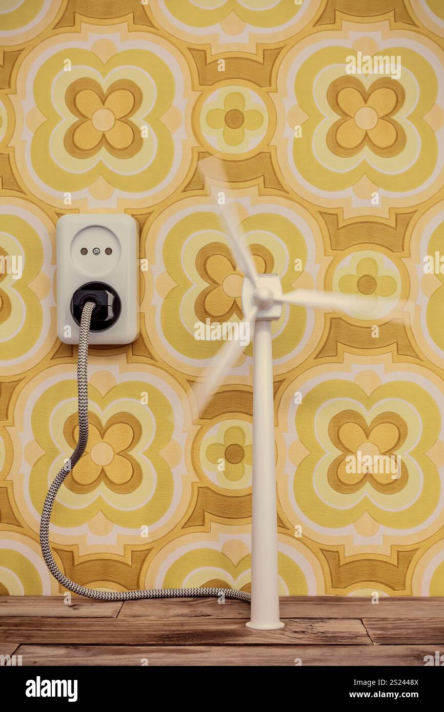 Wind turbine connected to a electric wall outlet with a background of ...