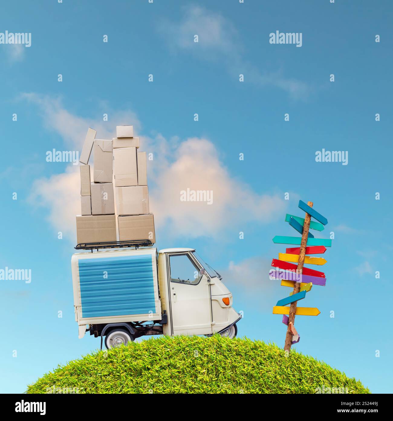 Vintage Italian three wheeled scooter van with cardboard boxes and ...