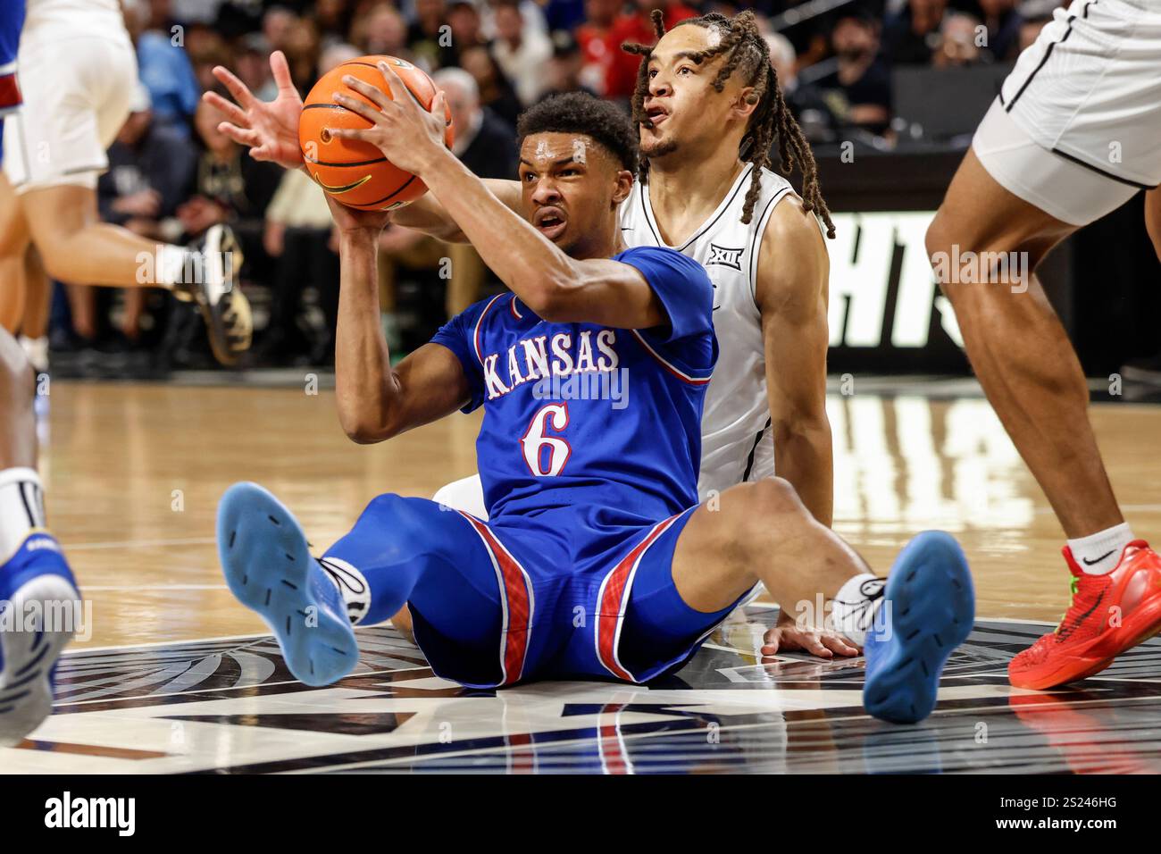 Kansas guard Rylan Griffen (6) and Central Florida forward Benny ...