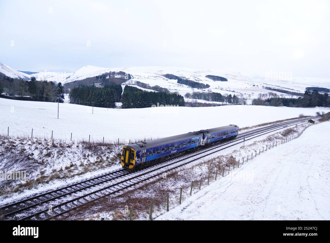 A ScotRail train in snowy conditions near Gleneagles in Perthshire ...
