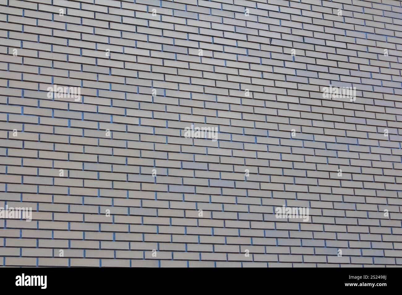 Light gray bricks are arranged horizontally, forming a contemporary ...