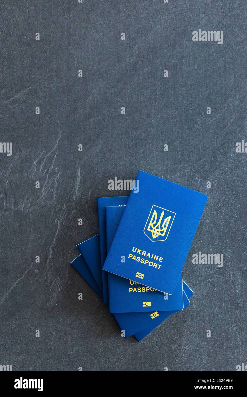 Ukraine passports stacked. Ukrainian biometric passport. Emigration ...
