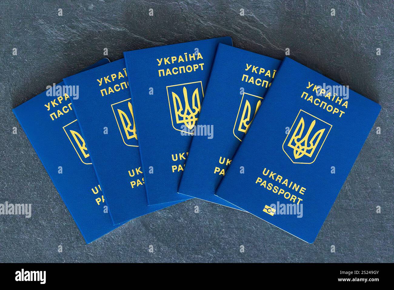 Ukraine passports stacked. Ukrainian biometric passport. Emigration ...