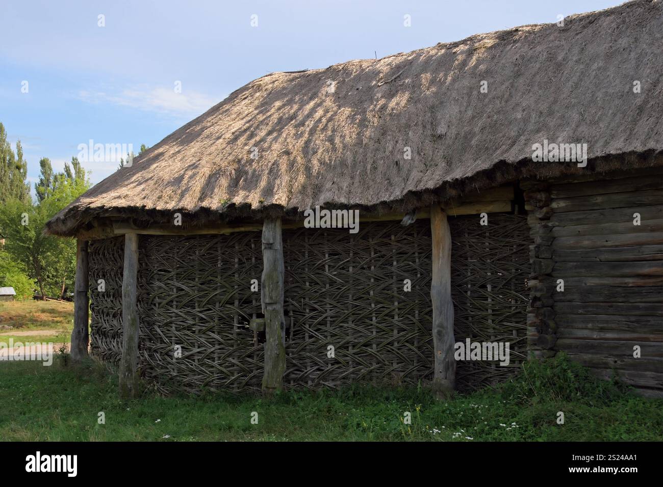 old wicker shed with thatch roof on historical country homestead Stock ...