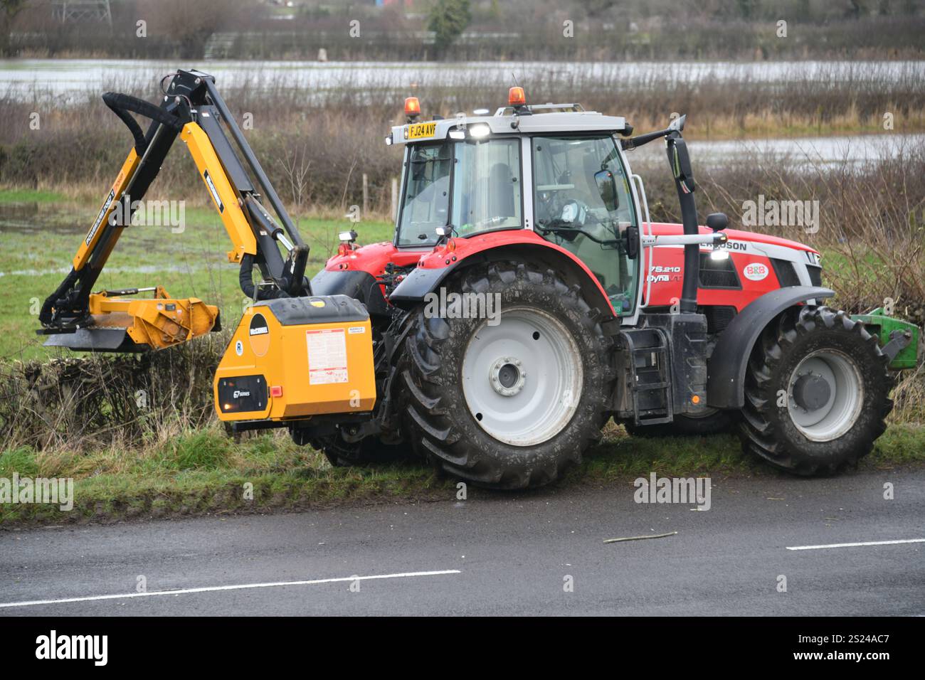 Massey Ferguson MF7S.210 Tractor with hedge cutter Stock Photo - Alamy