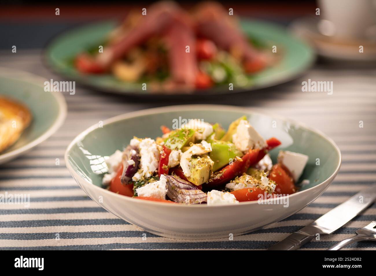 Dinner at Italian restaurant with salad assortment Stock Photo - Alamy