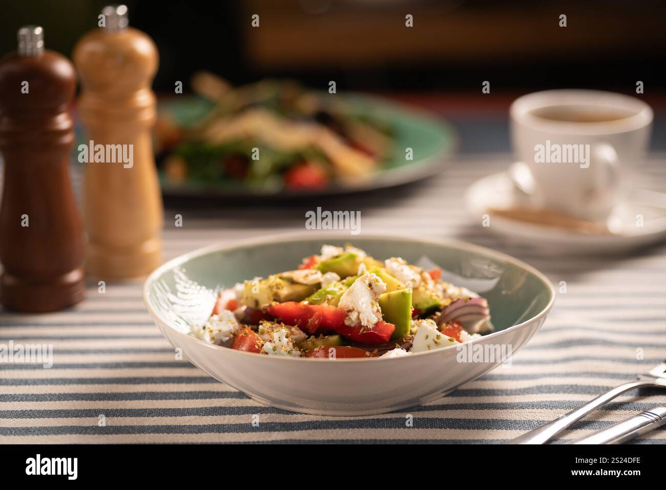 Italian avocado salad with feta and vegetables Stock Photo - Alamy