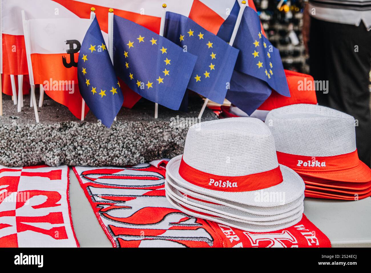 Polish and European Union flags with white hats and scarves showcasing ...