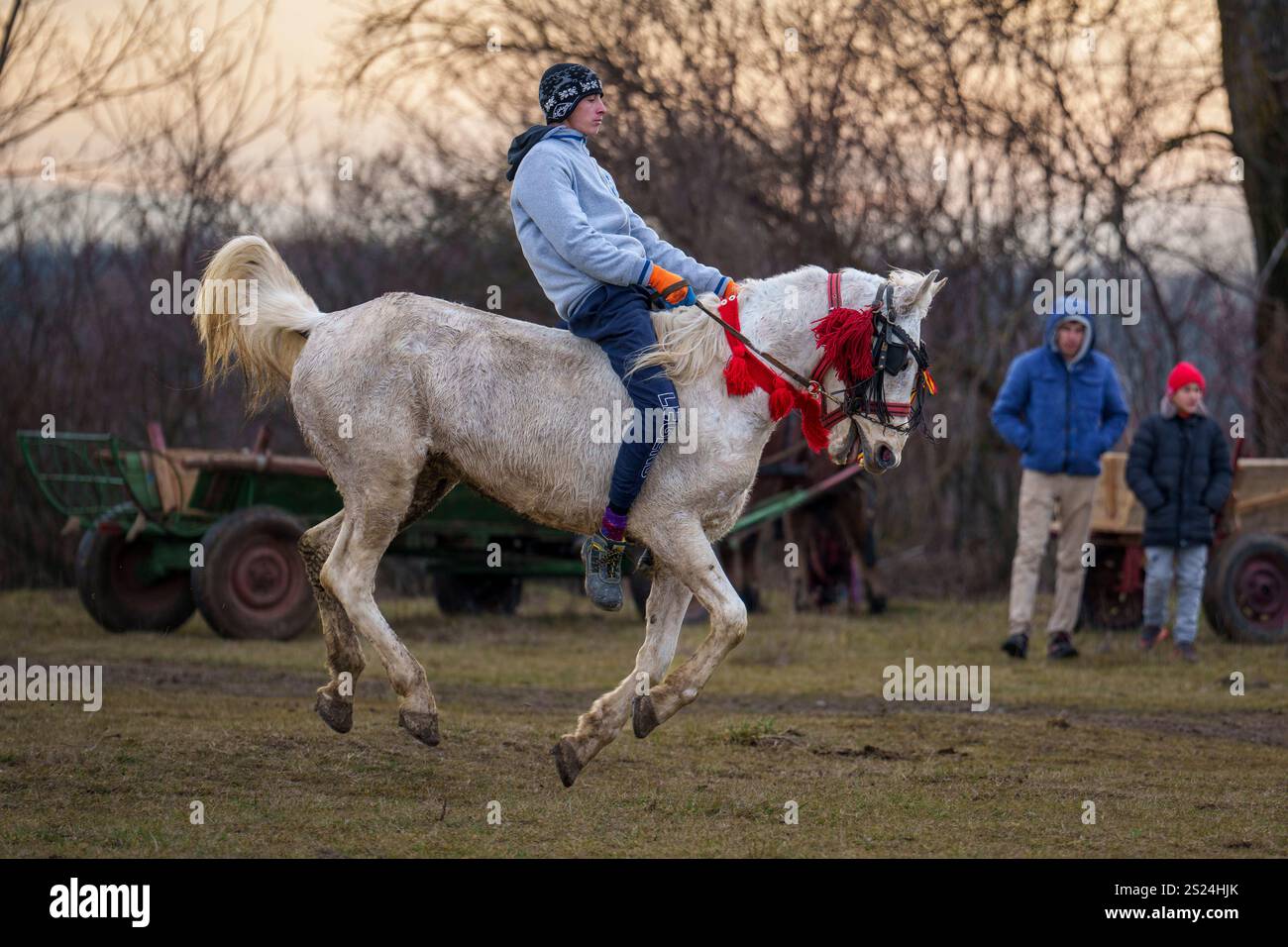 A man rides a horse while warming up for a traditional race during ...