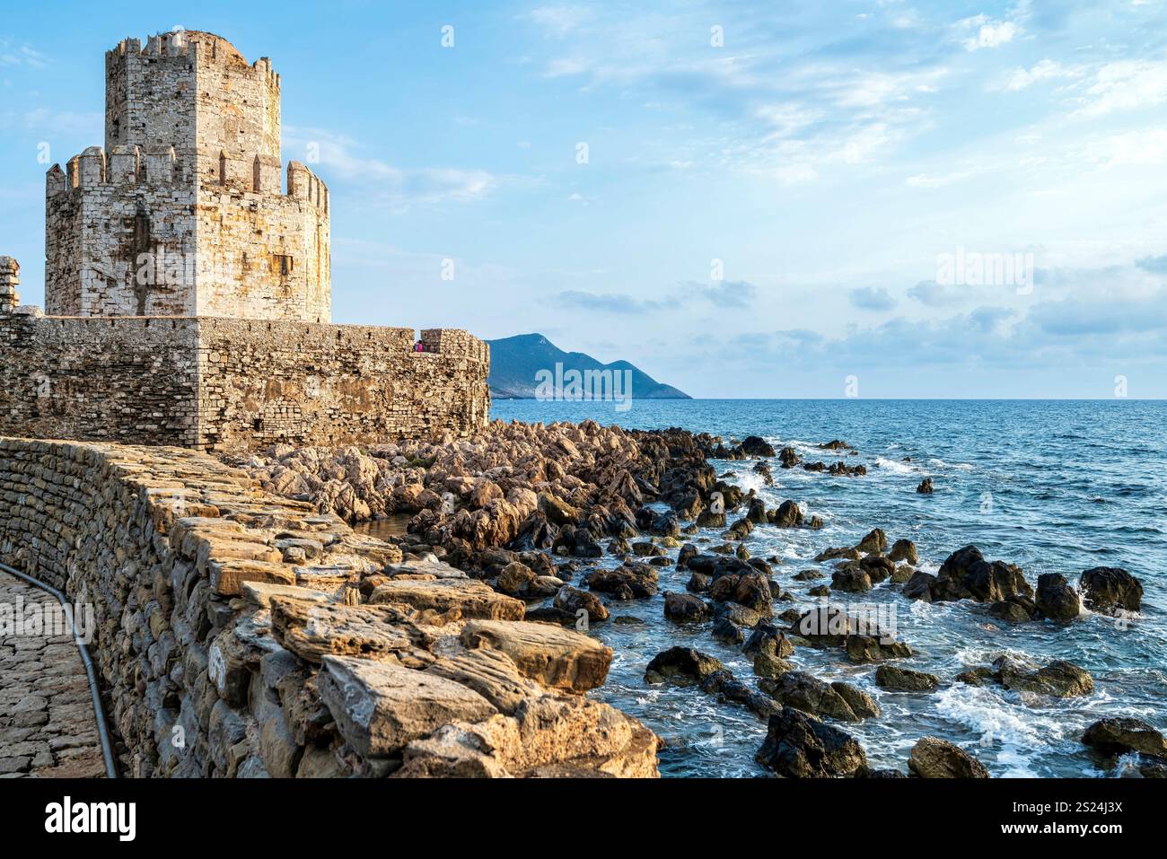The iconic Bourtzi Tower at Methoni Fortress, surrounded by rugged ...