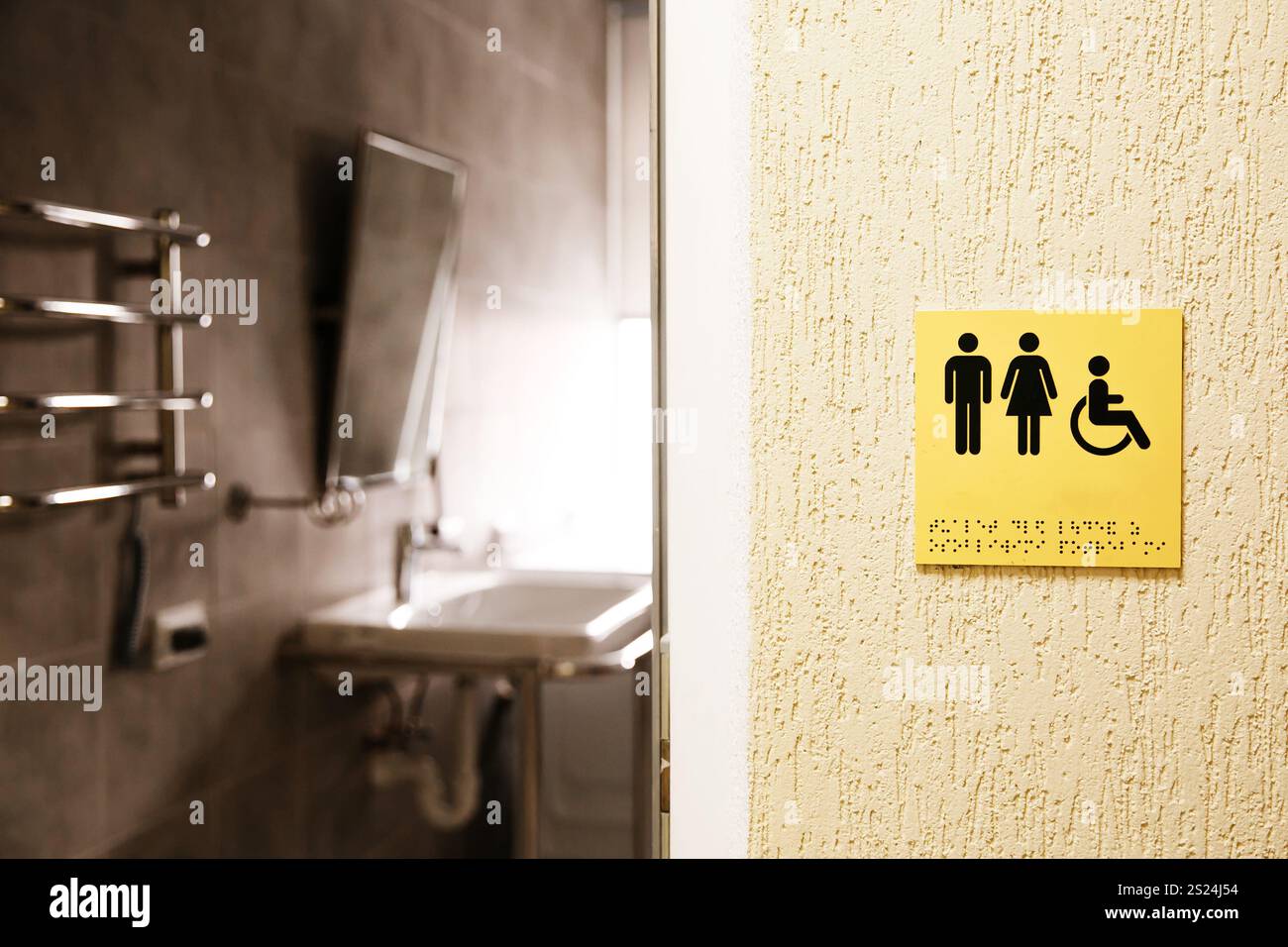 Sign of inclusive bathrooms. Accessible restroom sign directing ...